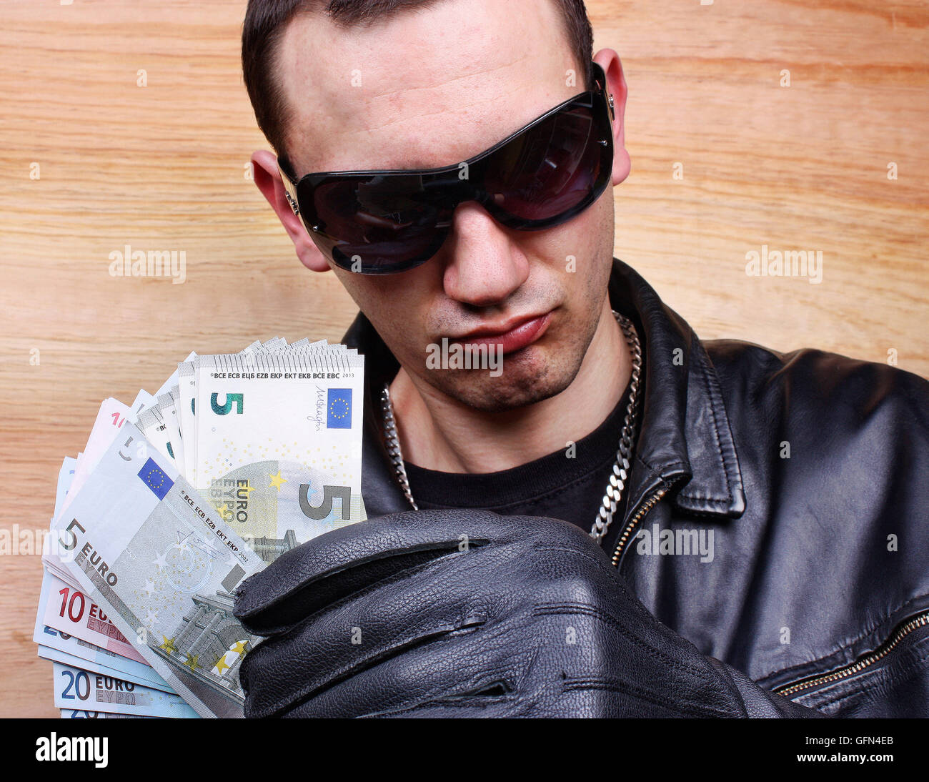 Chief boss mafia gangster thug with stolen money euro Stock Photo - Alamy