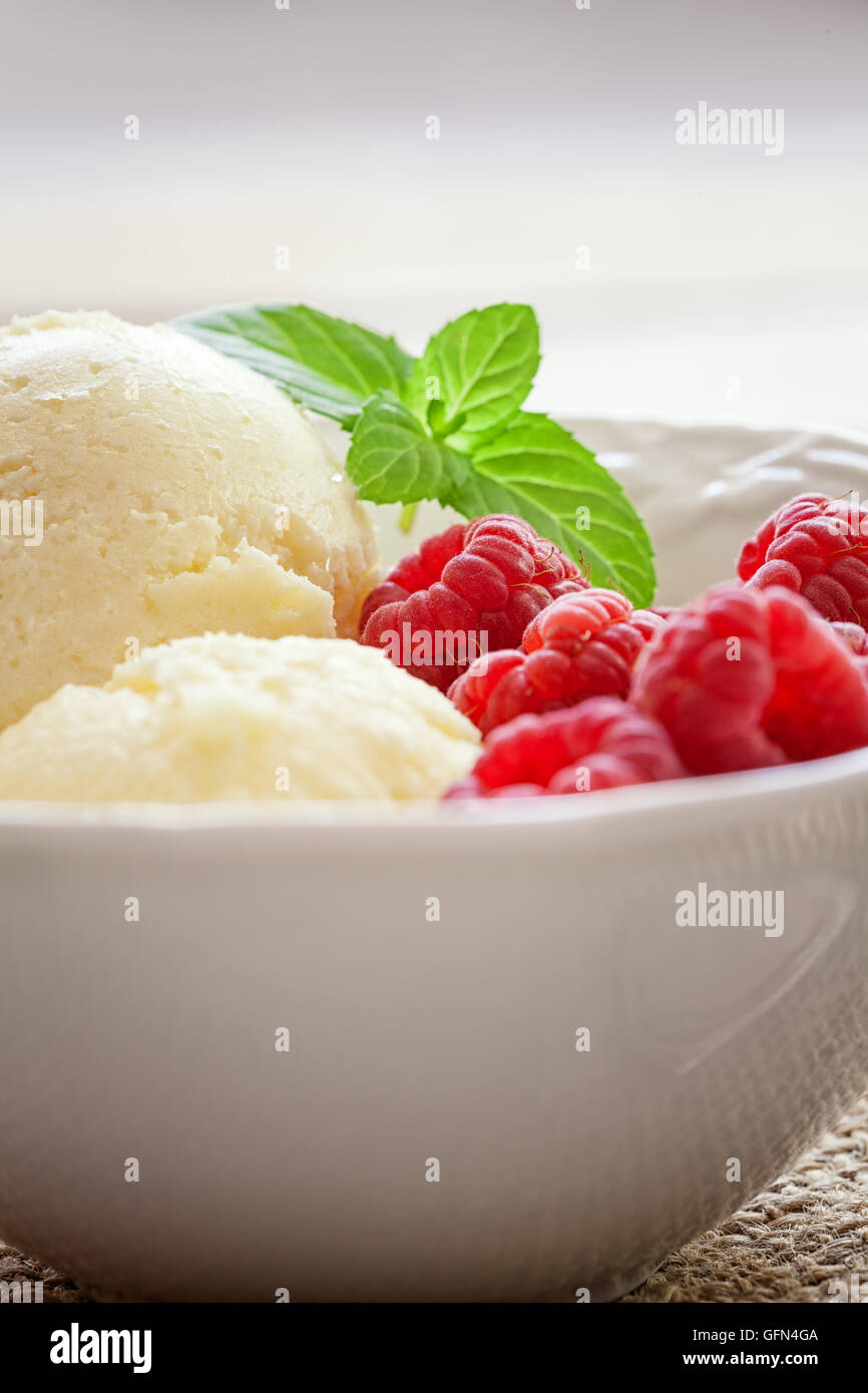 Vanilla ice cream with raspberry and mint Stock Photo - Alamy