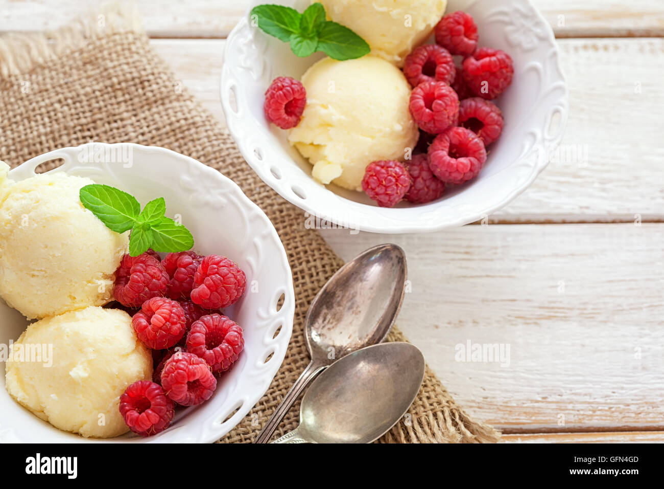 Vanilla ice cream with raspberry and mint Stock Photo - Alamy