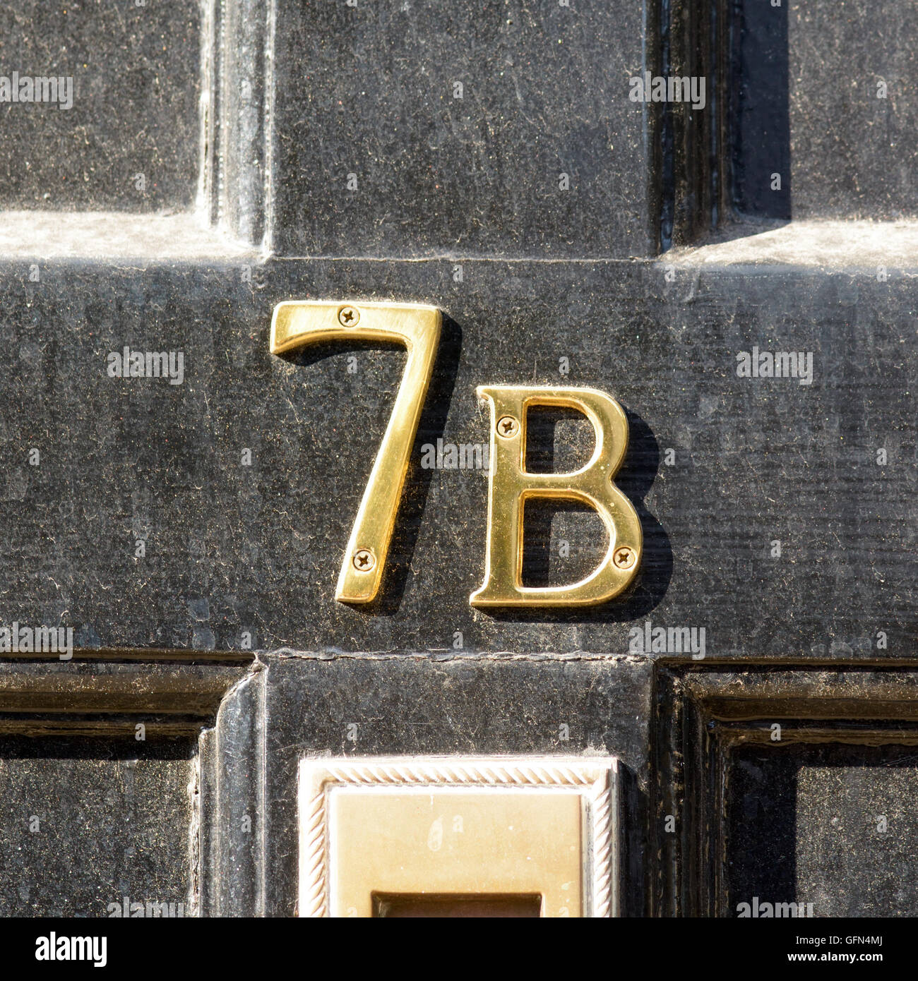 House number 7B sign on door Stock Photo - Alamy