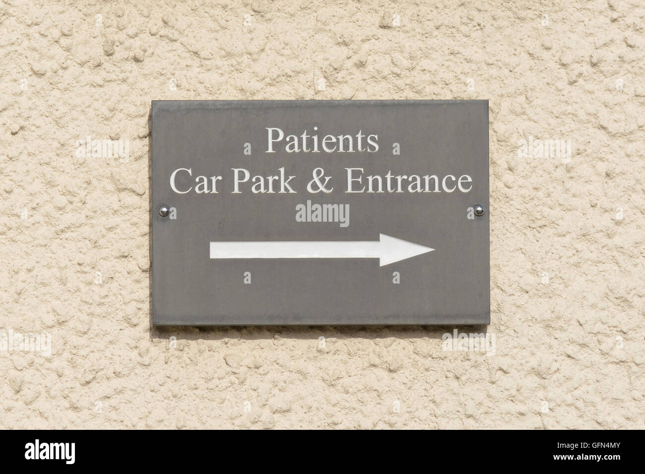 Patients Car Park and Entrance sign on wall outside Doctors surgery ...