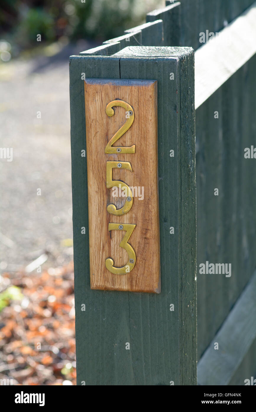 House number 253 sign on gate post Stock Photo - Alamy