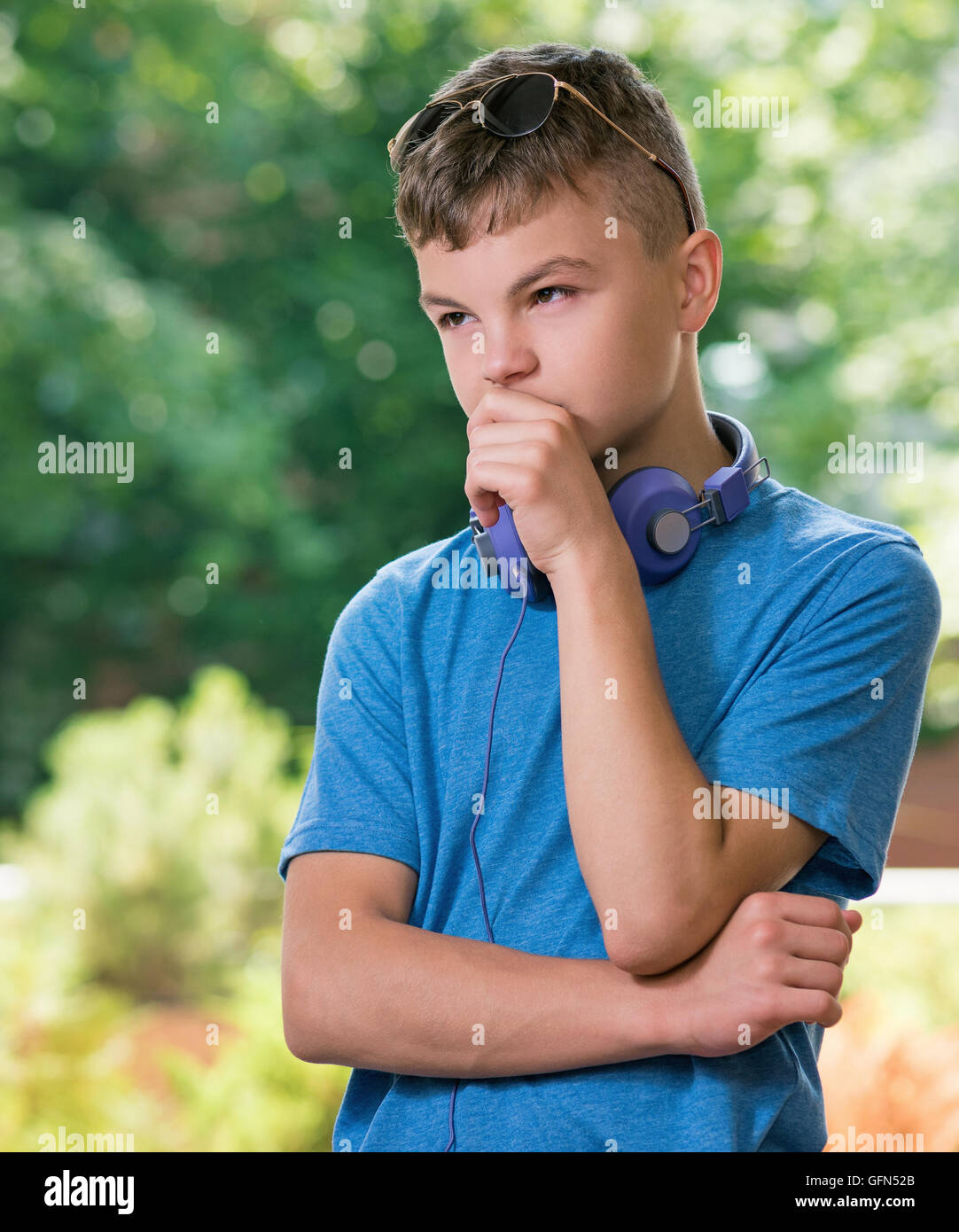 Teenage boy thinking Stock Photo - Alamy