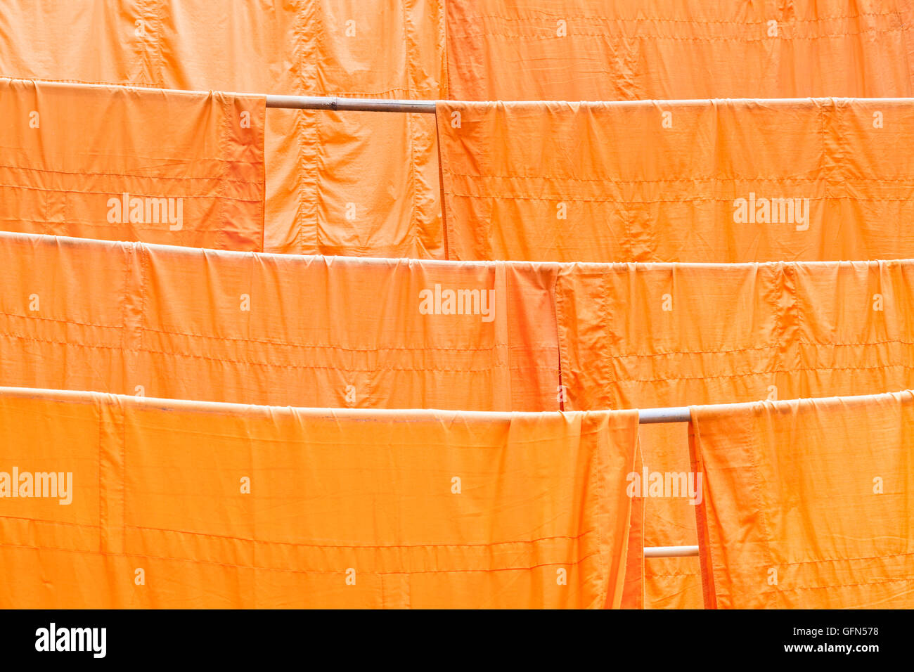 Robes of buddhist monks hanging out to dry at a temple in Thailand ...