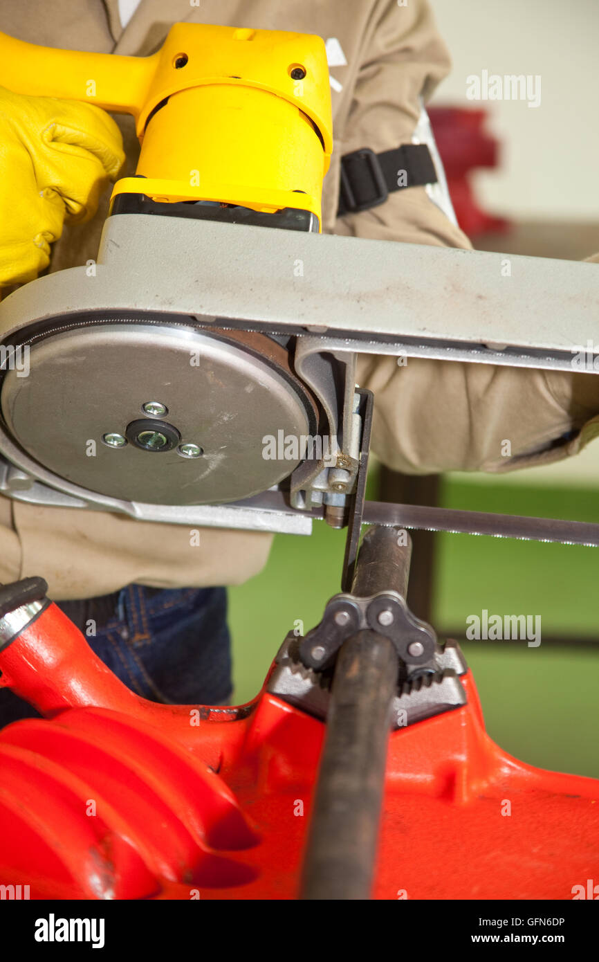 Worker cutting metal tube using hi-res stock photography and images - Alamy