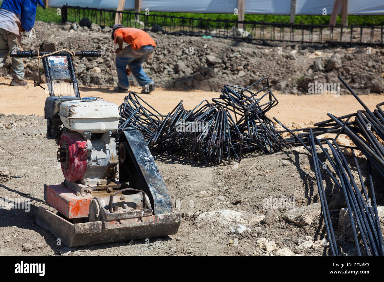 A compactor machine at a construction field Stock Photo - Alamy