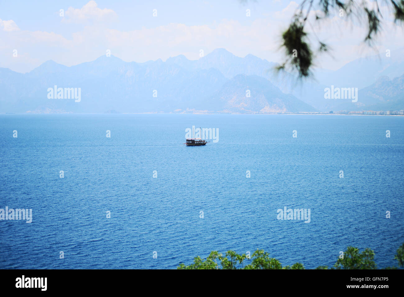 beautiful blue sea with boat Stock Photo - Alamy