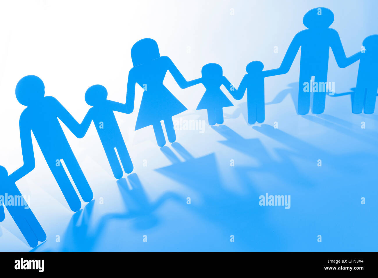 Family paper chain cutout holding hands Stock Photo - Alamy