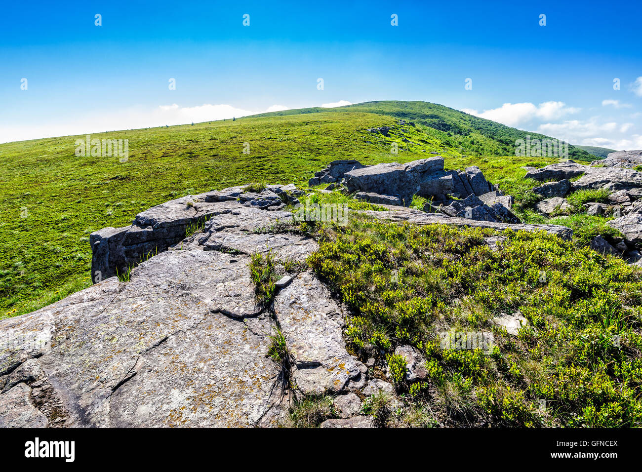 white sharp stones on the hillside on top of mountain range Stock Photo ...