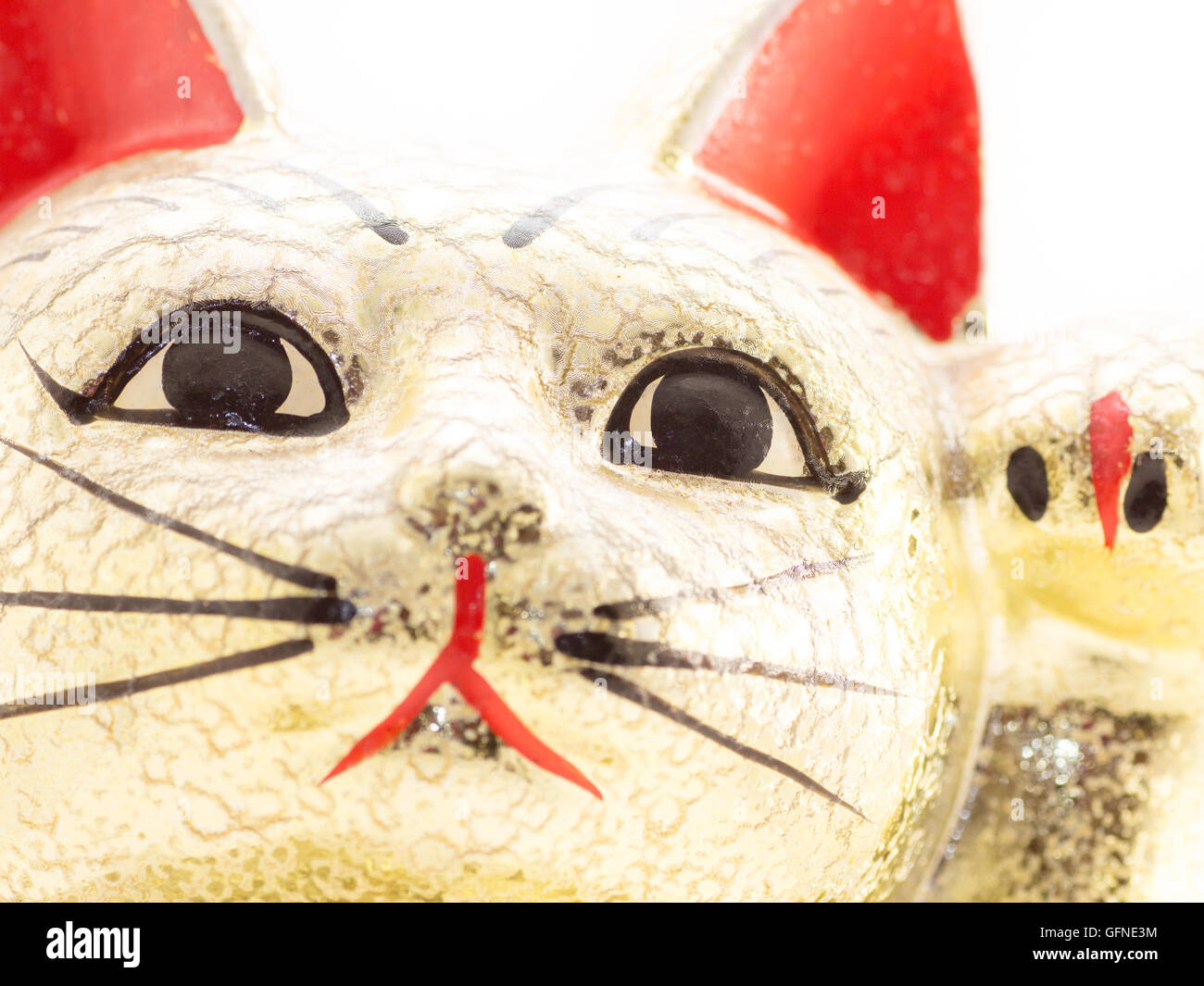 Gold Japanese beckoning cat called Manekineko on white isolated ...