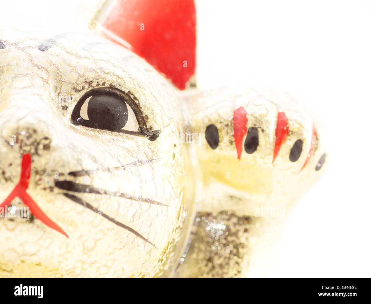 Gold Japanese beckoning cat called Manekineko on white isolated ...