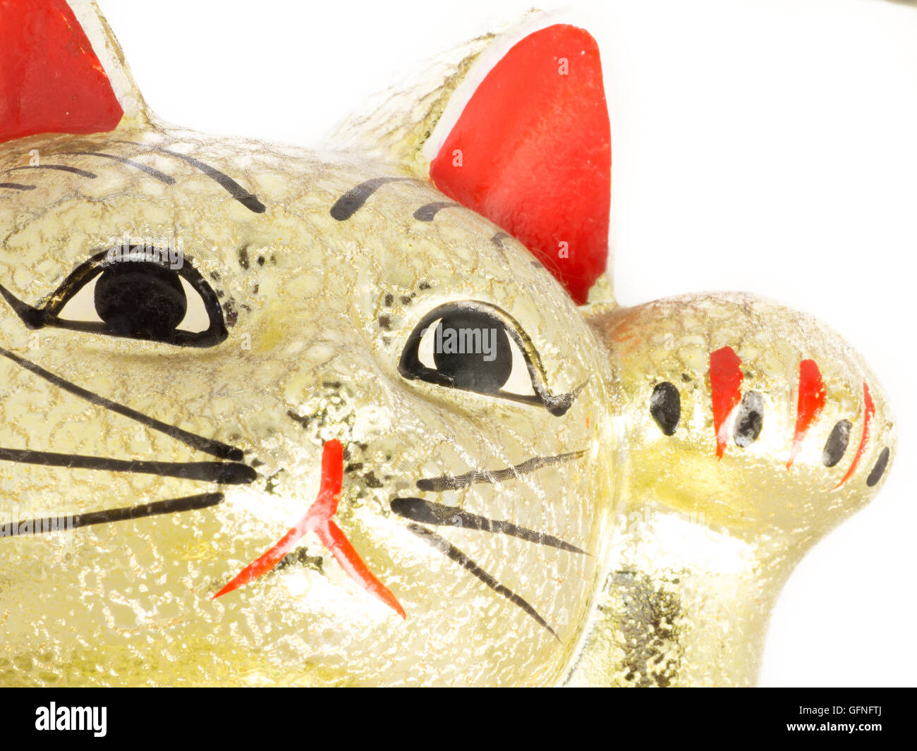 Gold Japanese beckoning cat called Manekineko on white isolated ...