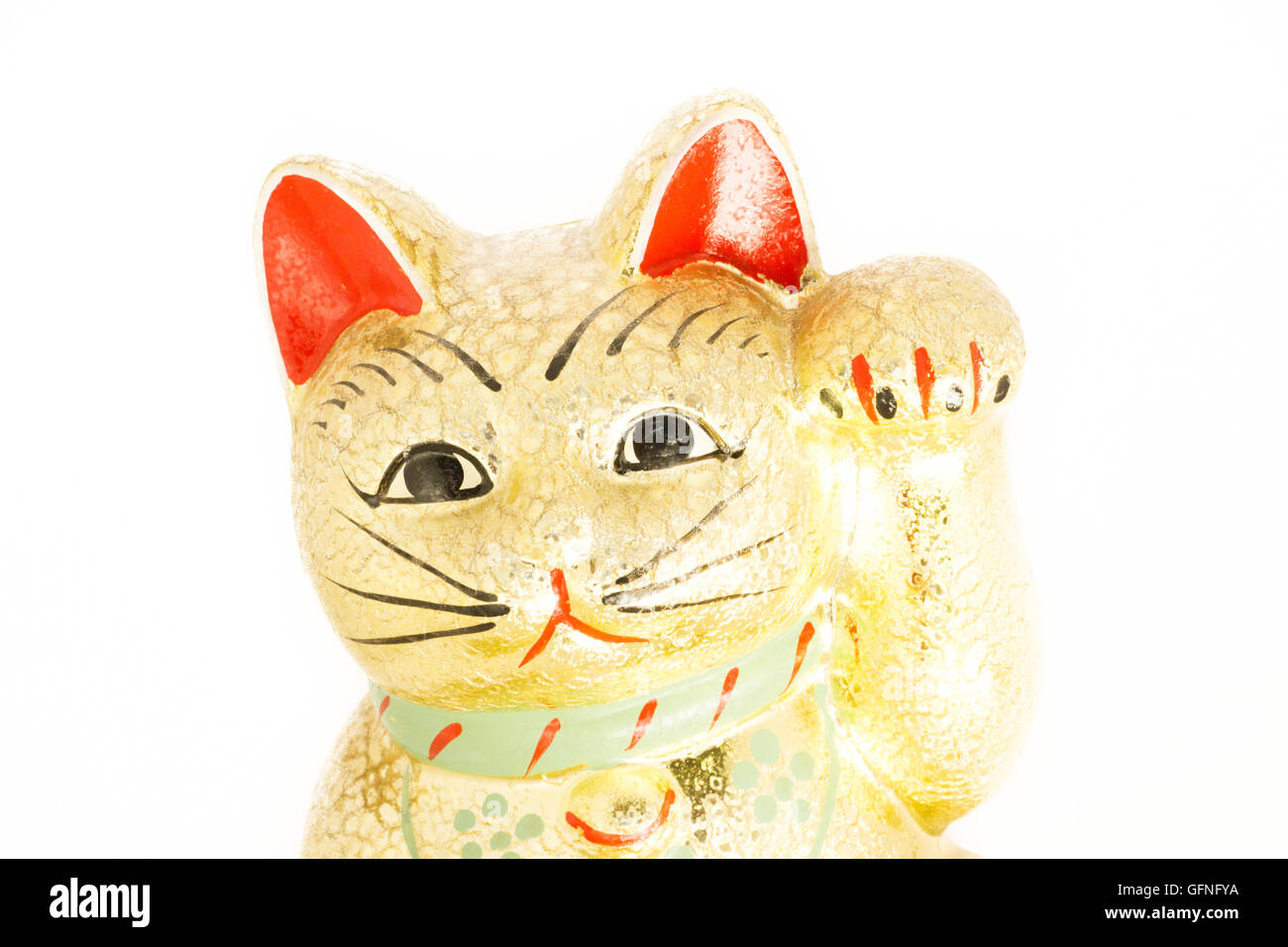 Gold Japanese beckoning cat called Manekineko on white isolated ...