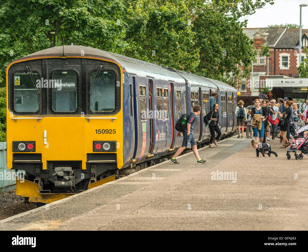 Passengers disembark on to the bustling platform from the Great Western ...