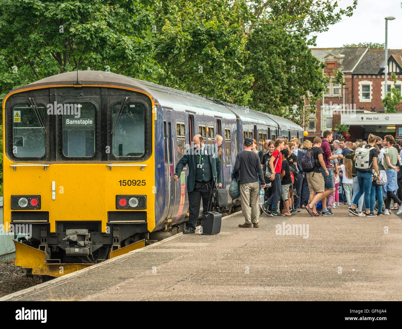 Passengers disembark on to the bustling platform from the Great Western ...