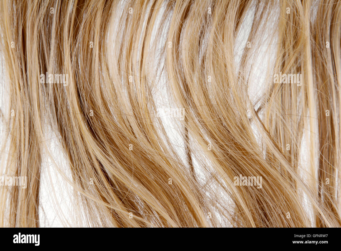 Blond hair on plain background Stock Photo - Alamy
