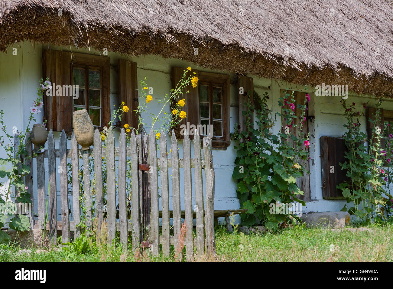 Old thatched cottage in small hi-res stock photography and images - Alamy