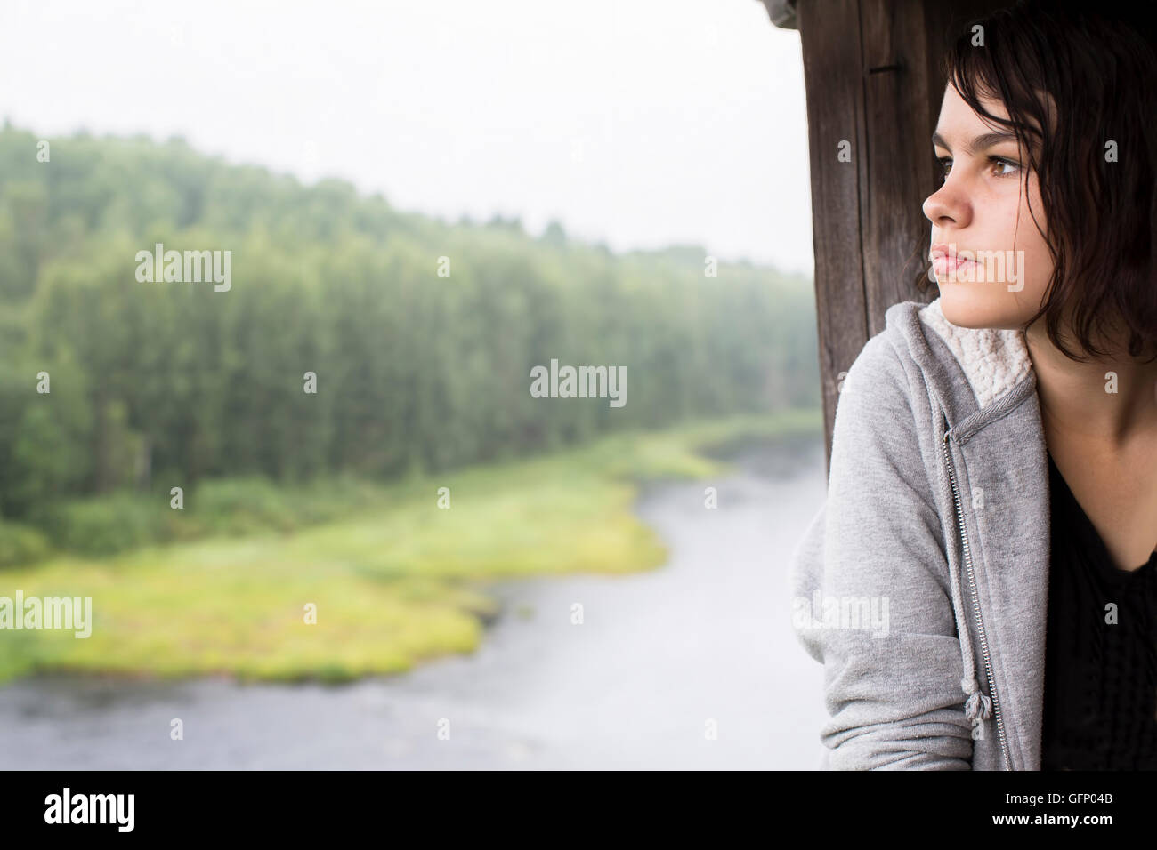 Young pretty girl is looking at the nature from above Stock Photo - Alamy