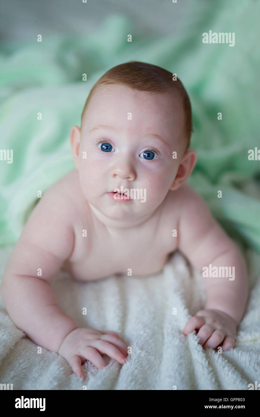 Closeup portrait of a cute baby with naive expression Stock Photo - Alamy