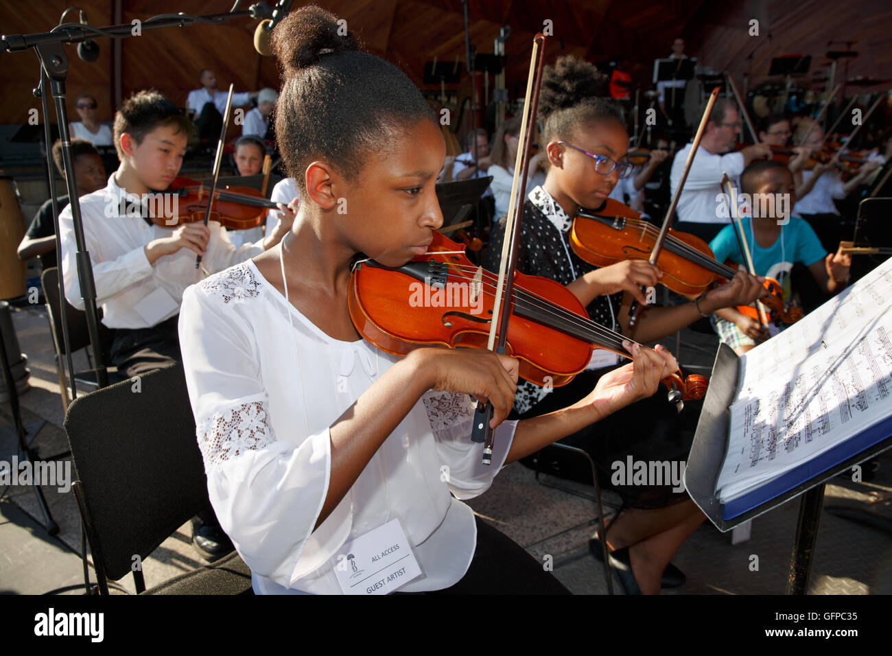 Young musicians playing with the Boston Landmarks Orchestra at the ...
