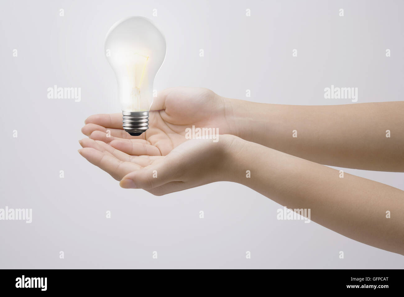 Japanese woman with light bulb Stock Photo - Alamy