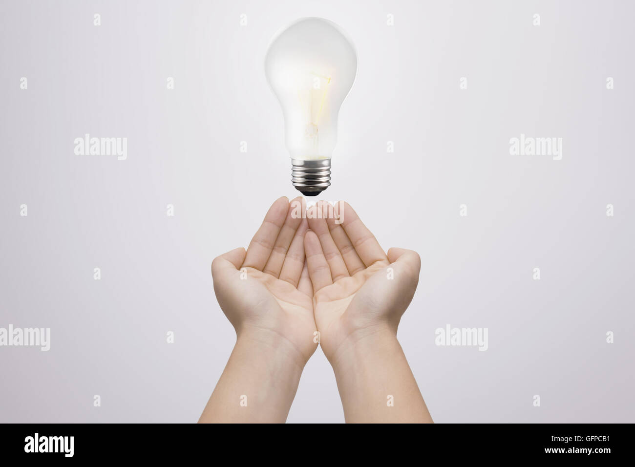 Japanese woman with light bulb Stock Photo - Alamy