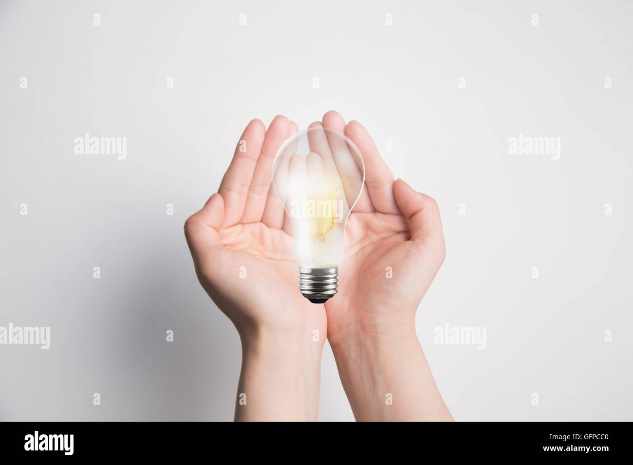 Japanese woman with light bulb Stock Photo - Alamy