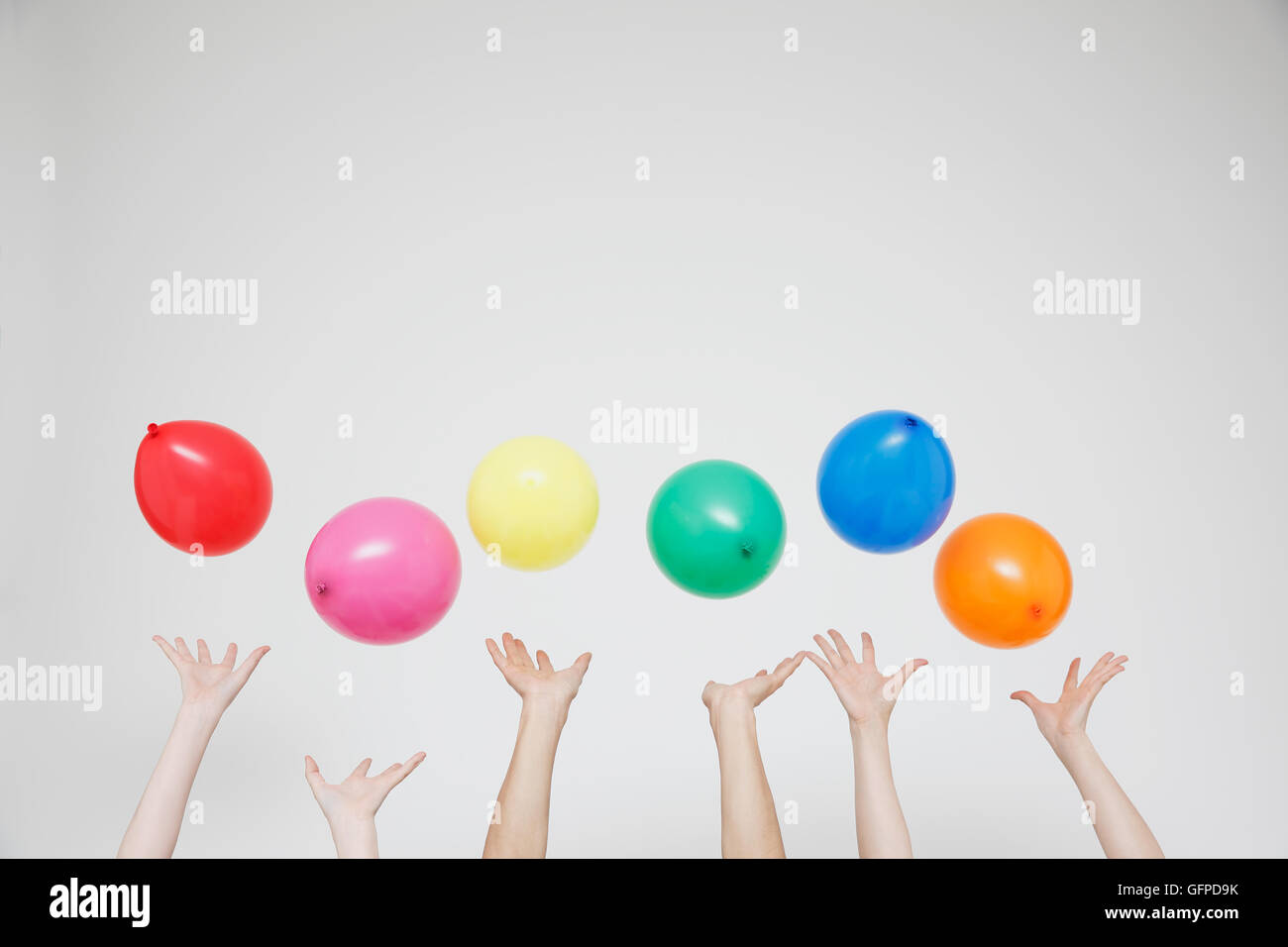 Hands with balloons Stock Photo - Alamy