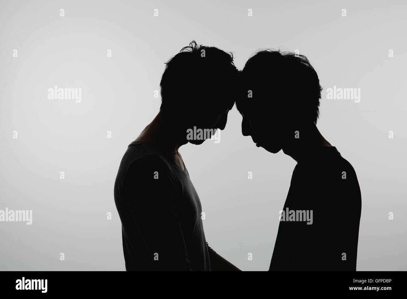Two silhouette facing each other hi-res stock photography and images ...