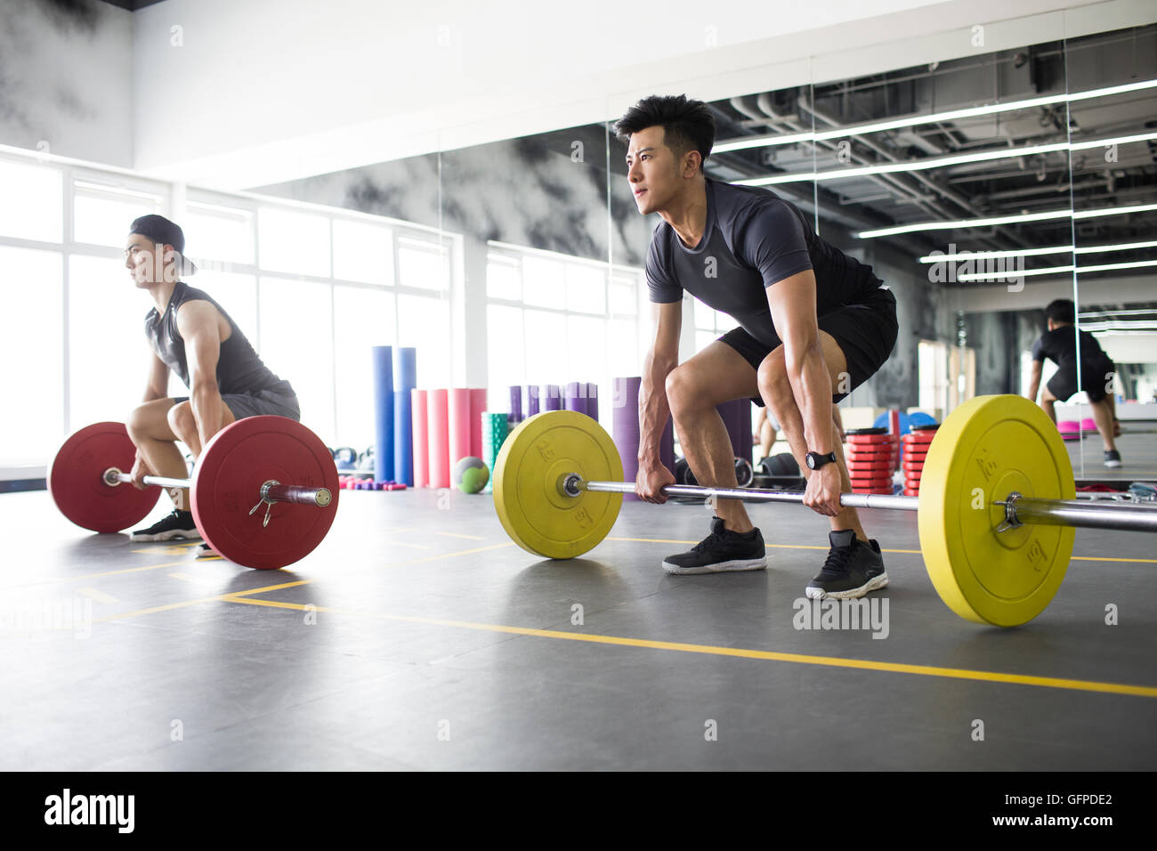 Two men lifting legs hi-res stock photography and images - Alamy