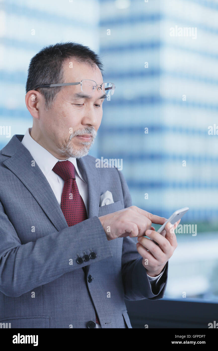 Japanese businessman in a modern office Stock Photo - Alamy