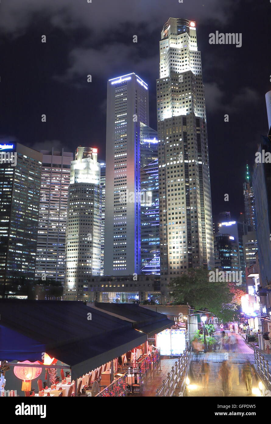 Singapore skyline and Boat Quay by night Stock Photo - Alamy