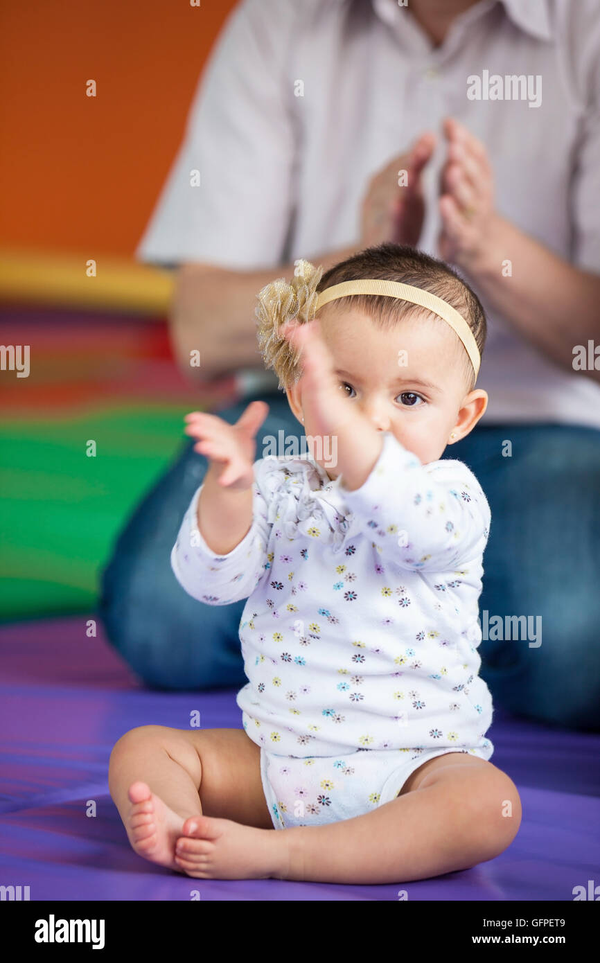 Clapping with Dad Stock Photo - Alamy