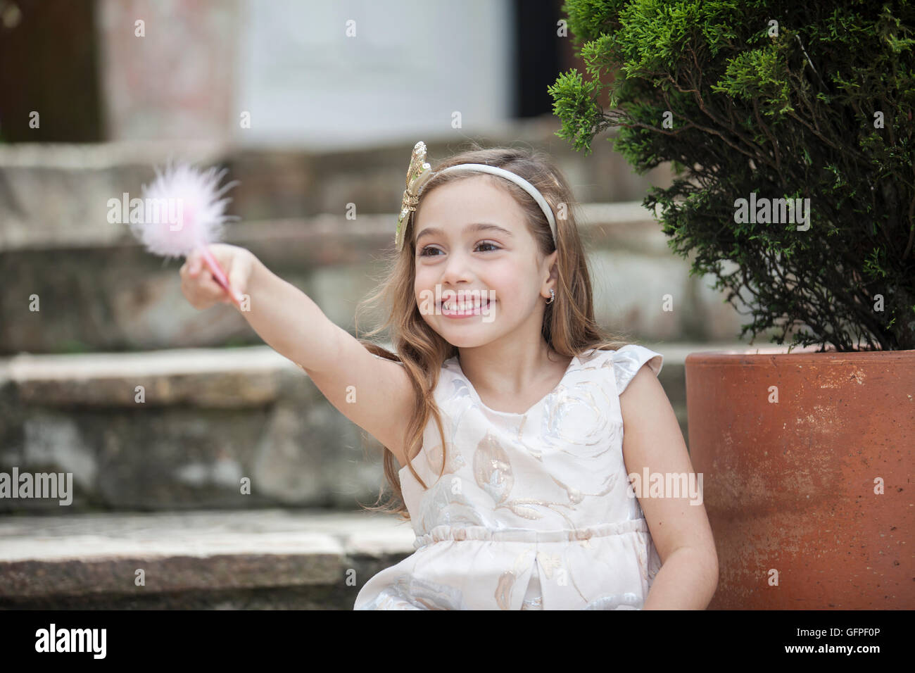 Little blonde writer outdoors looking for inspiration Stock Photo - Alamy