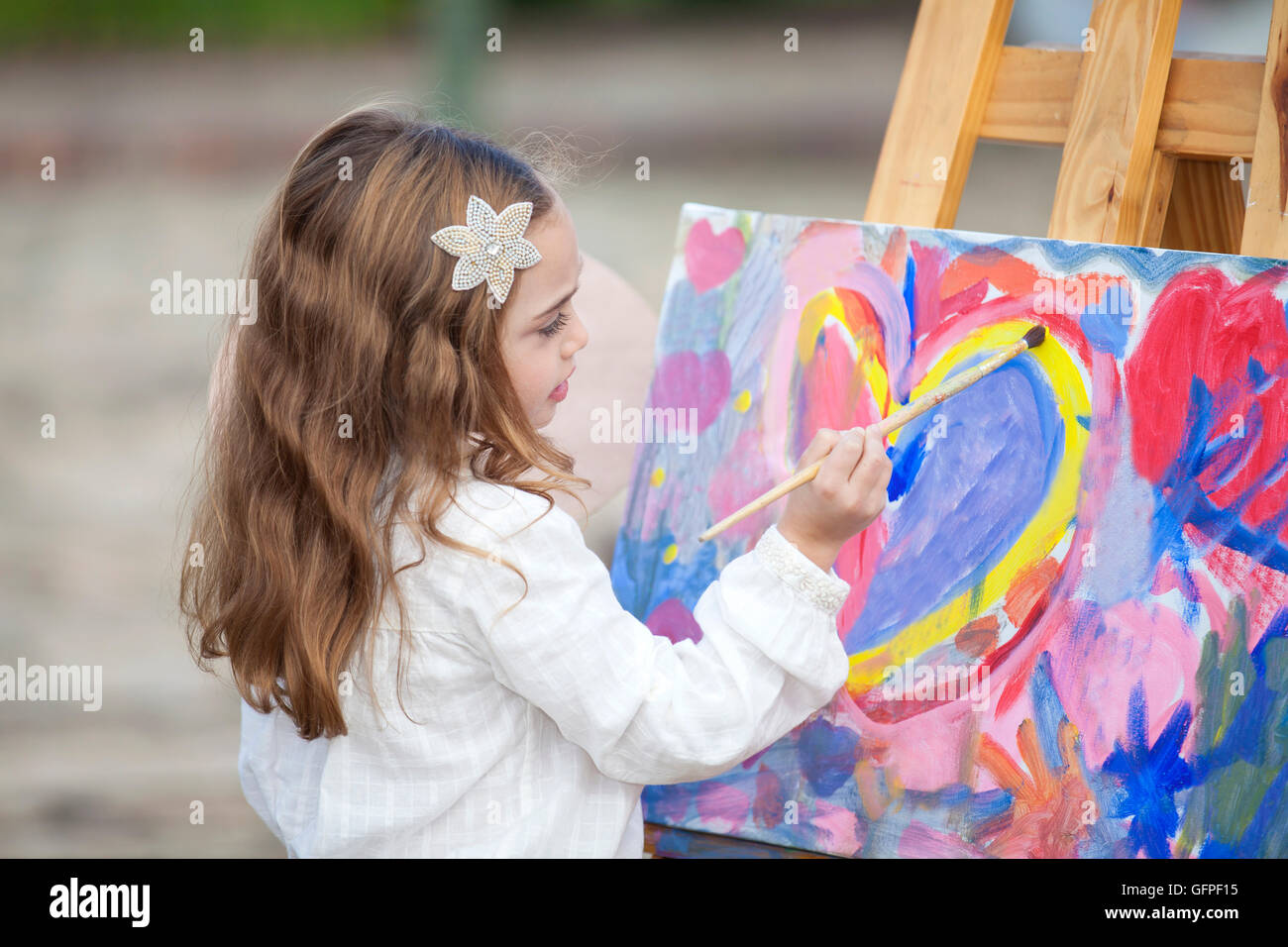Child painting easel hi-res stock photography and images - Alamy
