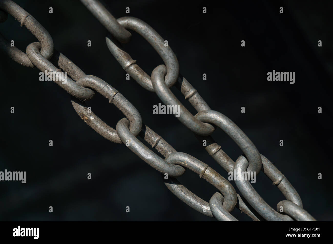 Strong chain on black background Stock Photo - Alamy
