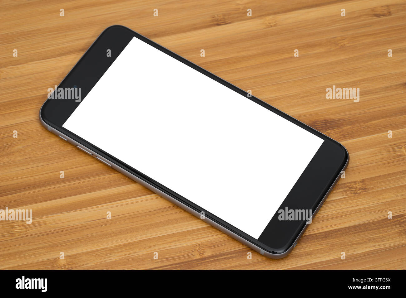 Smartphone on the desk, close-up Stock Photo - Alamy