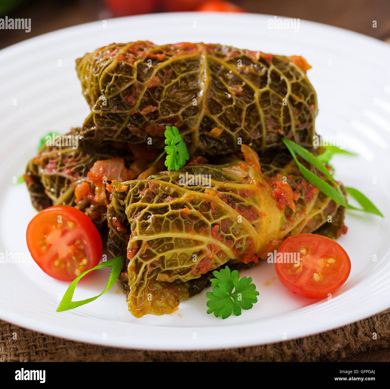 Stuffed savoy cabbage rolls in tomato sauce Stock Photo - Alamy