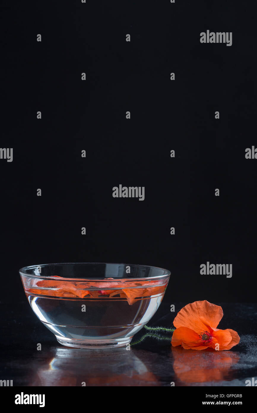 Poppy in glass cup Stock Photo - Alamy