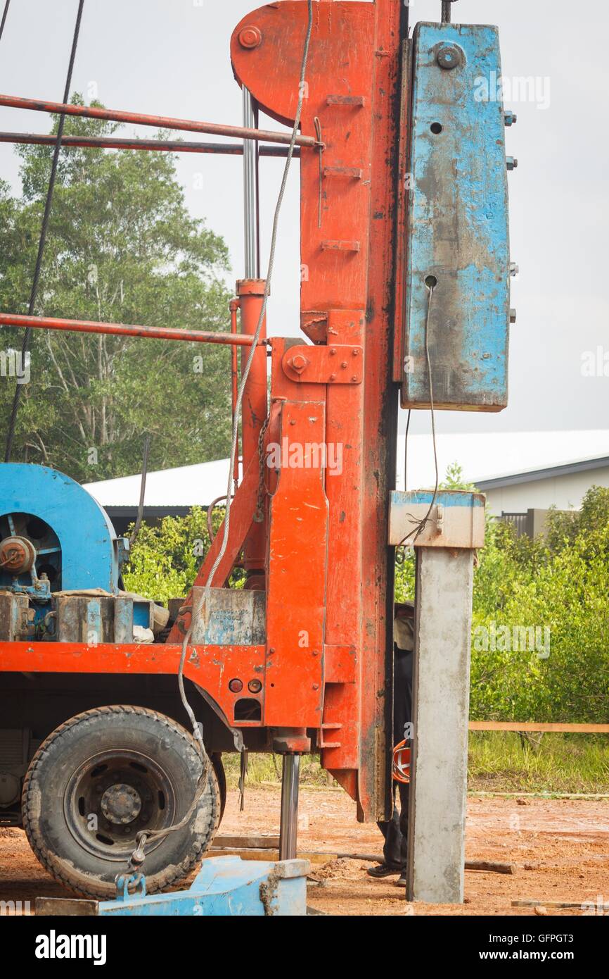 Builders hammer in piles on the weir building site Stock Photo - Alamy
