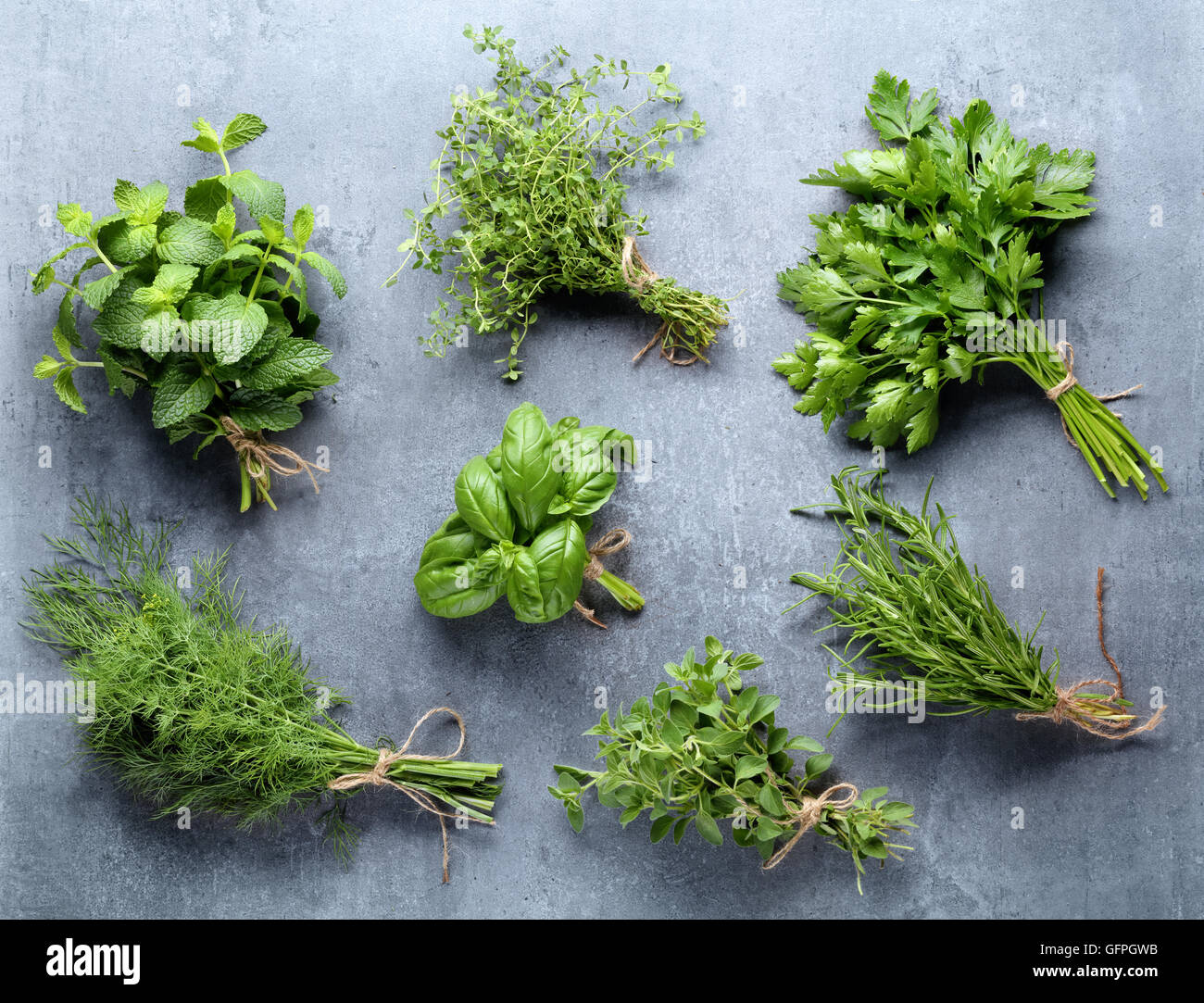 Fresh herbs on stone background Stock Photo - Alamy
