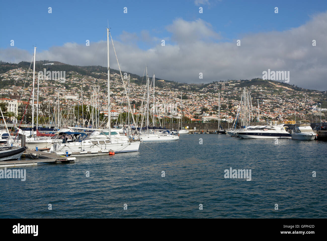 Boats moored in marina and harbour on the seafront of Funchal, Madeira ...