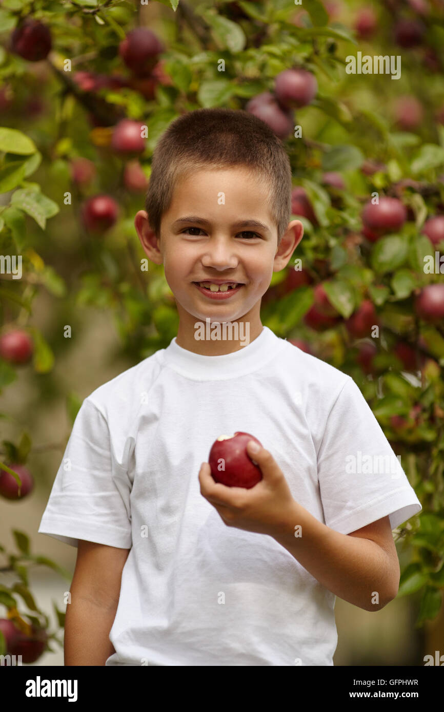 funny boy with apple Stock Photo - Alamy