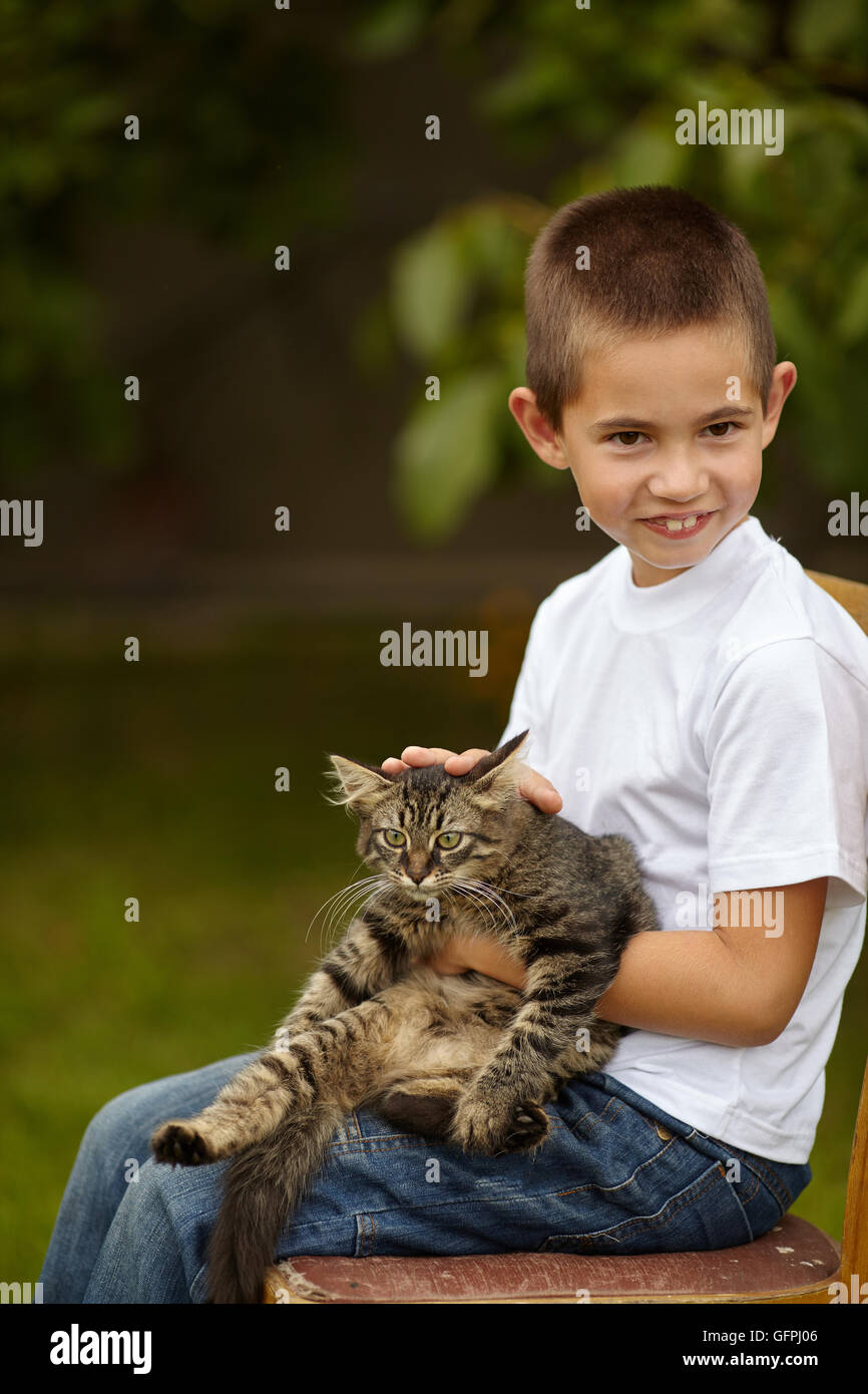 funny boy with cat Stock Photo - Alamy