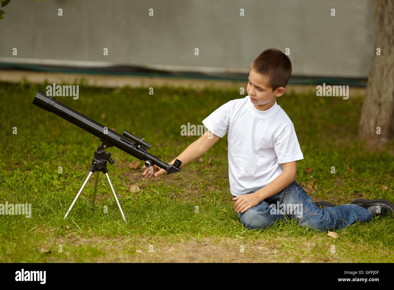 happy little boy with telescope Stock Photo - Alamy