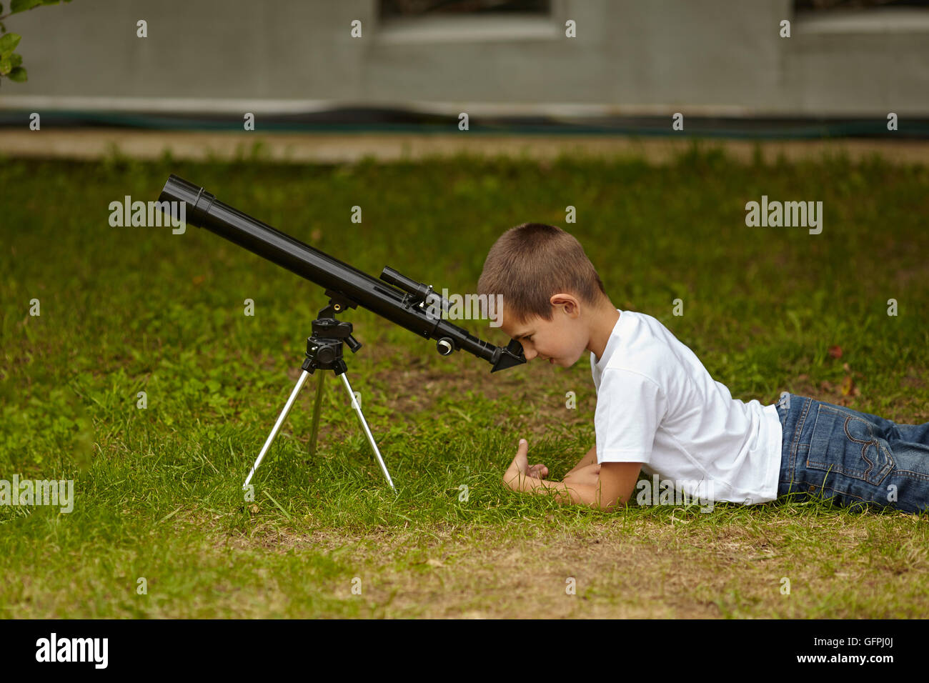 happy little boy with telescope Stock Photo - Alamy