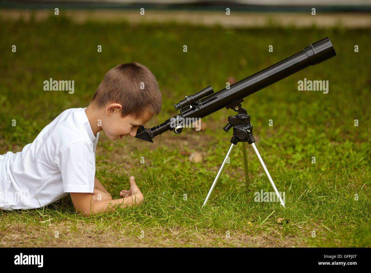 happy little boy with telescope Stock Photo - Alamy