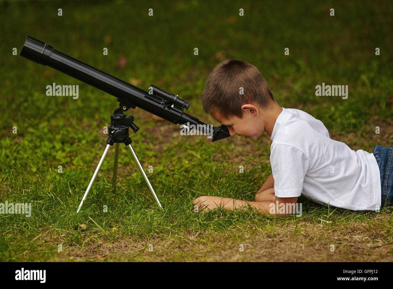 happy little boy with telescope Stock Photo - Alamy
