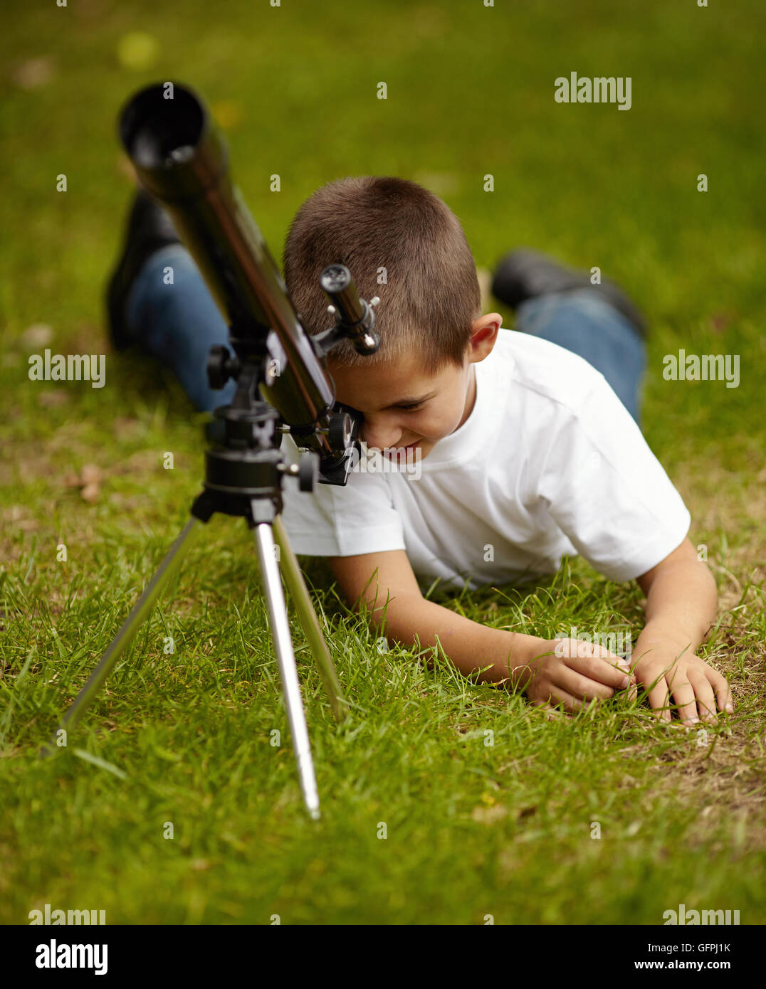 happy little boy with telescope Stock Photo - Alamy