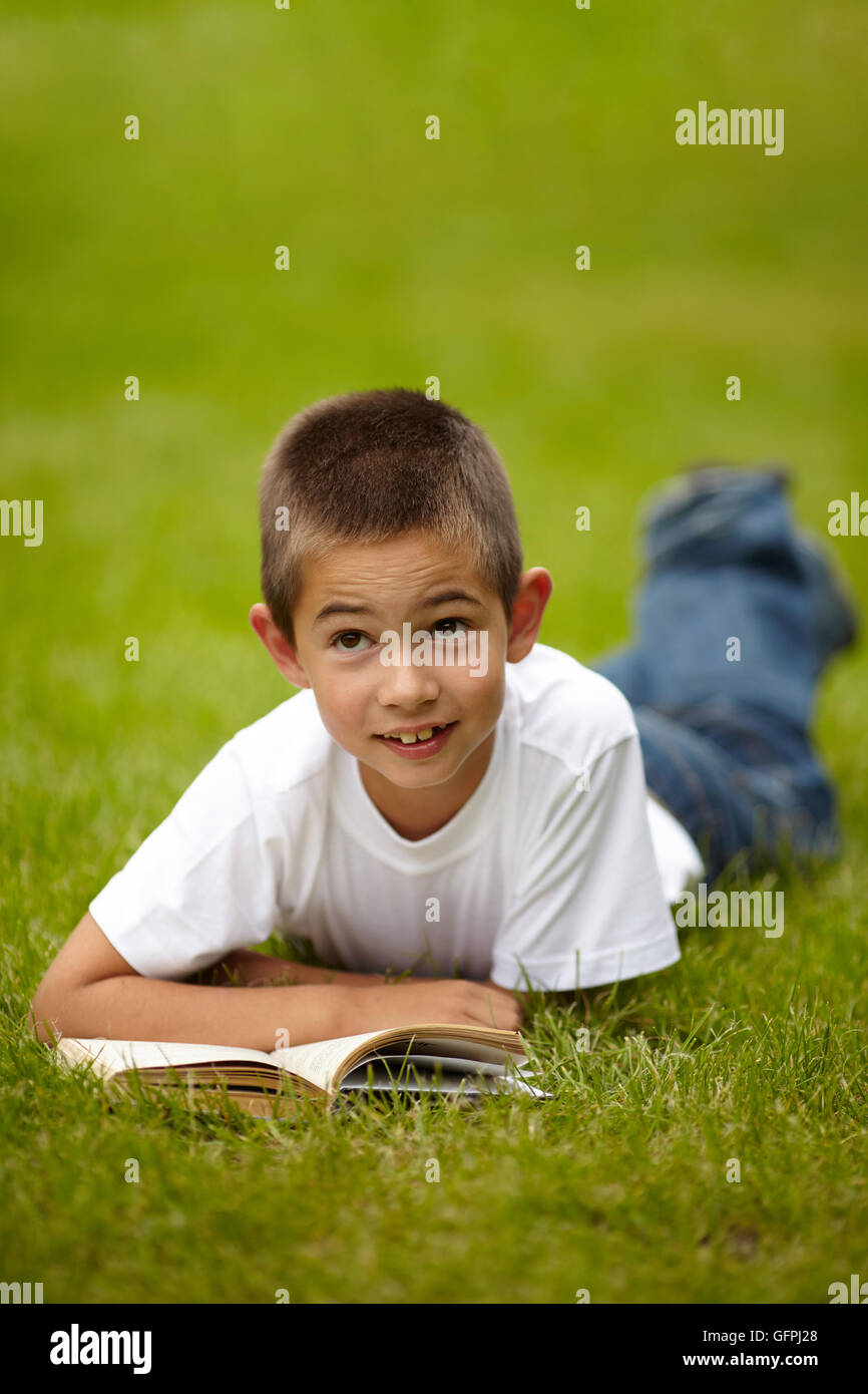 little happy boy reading book Stock Photo - Alamy